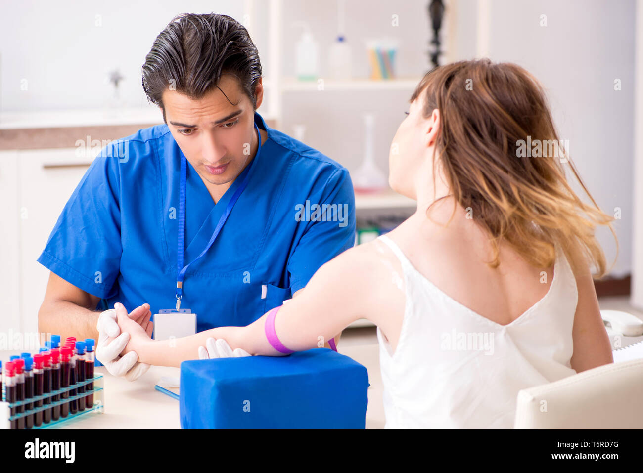 Young patient during blood test sampling procedure Stock Photo - Alamy