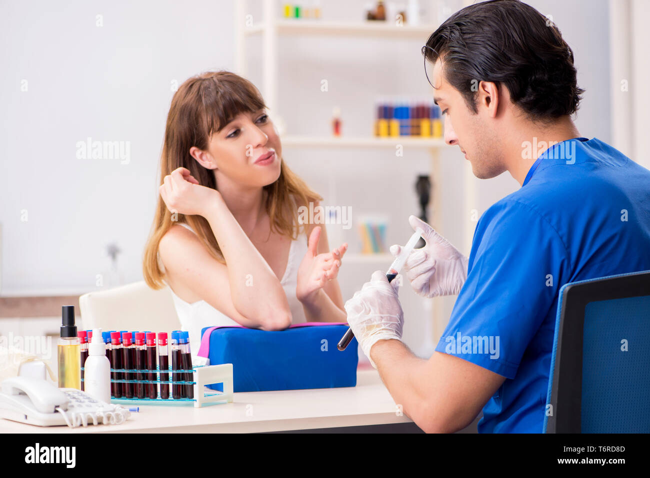 Young patient during blood test sampling procedure Stock Photo - Alamy