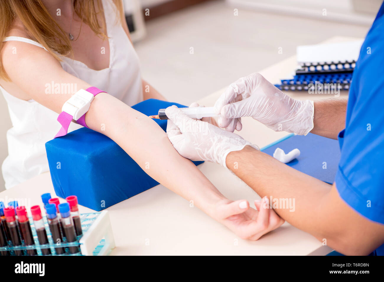 Young patient during blood test sampling procedure Stock Photo - Alamy