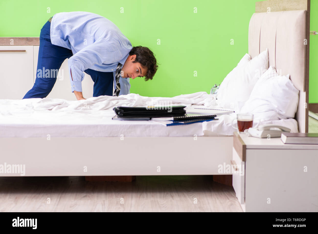 Young businessman employee late for office Stock Photo - Alamy