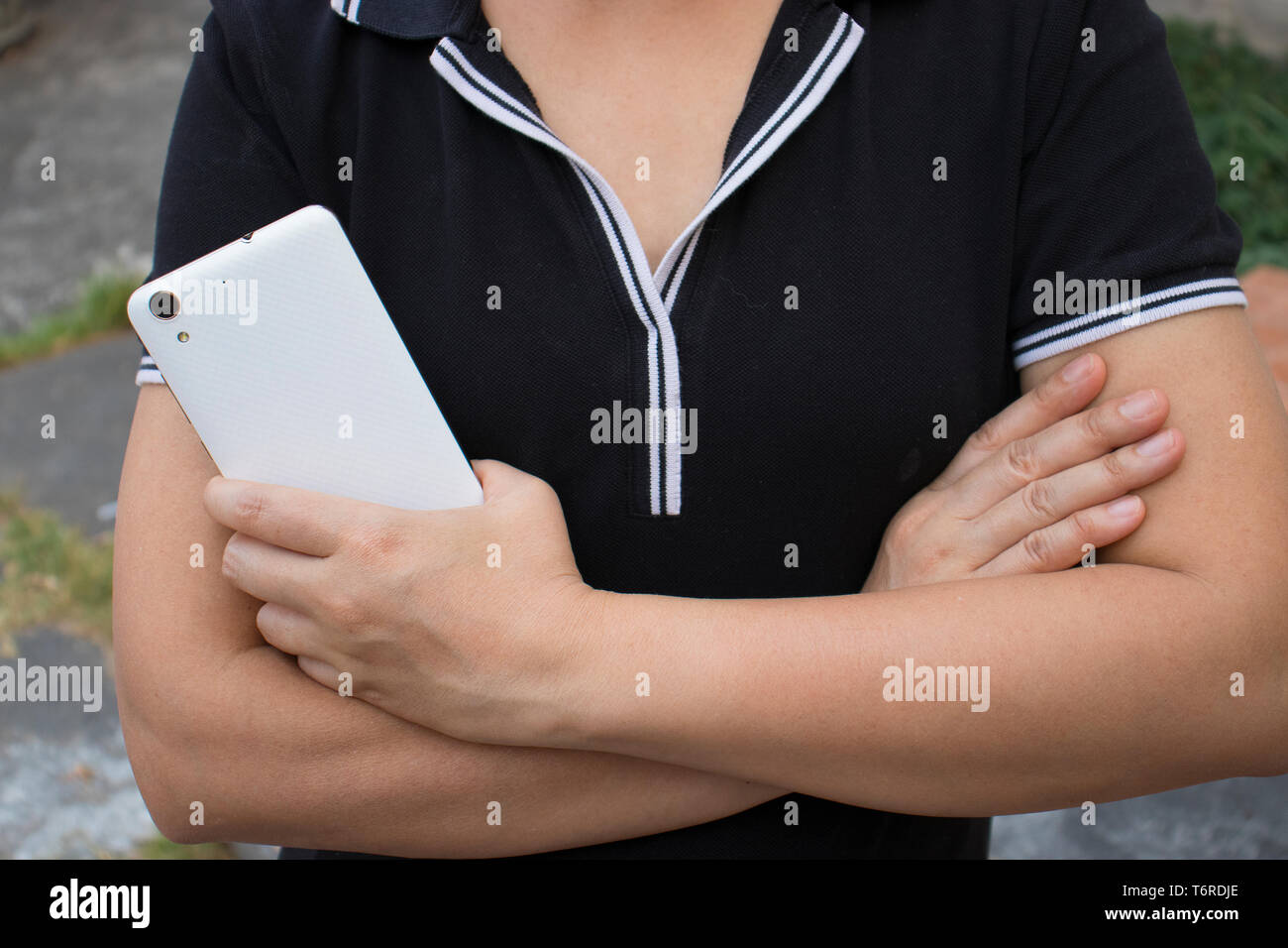 Asian woman holding and using smart phone show back side. High ...