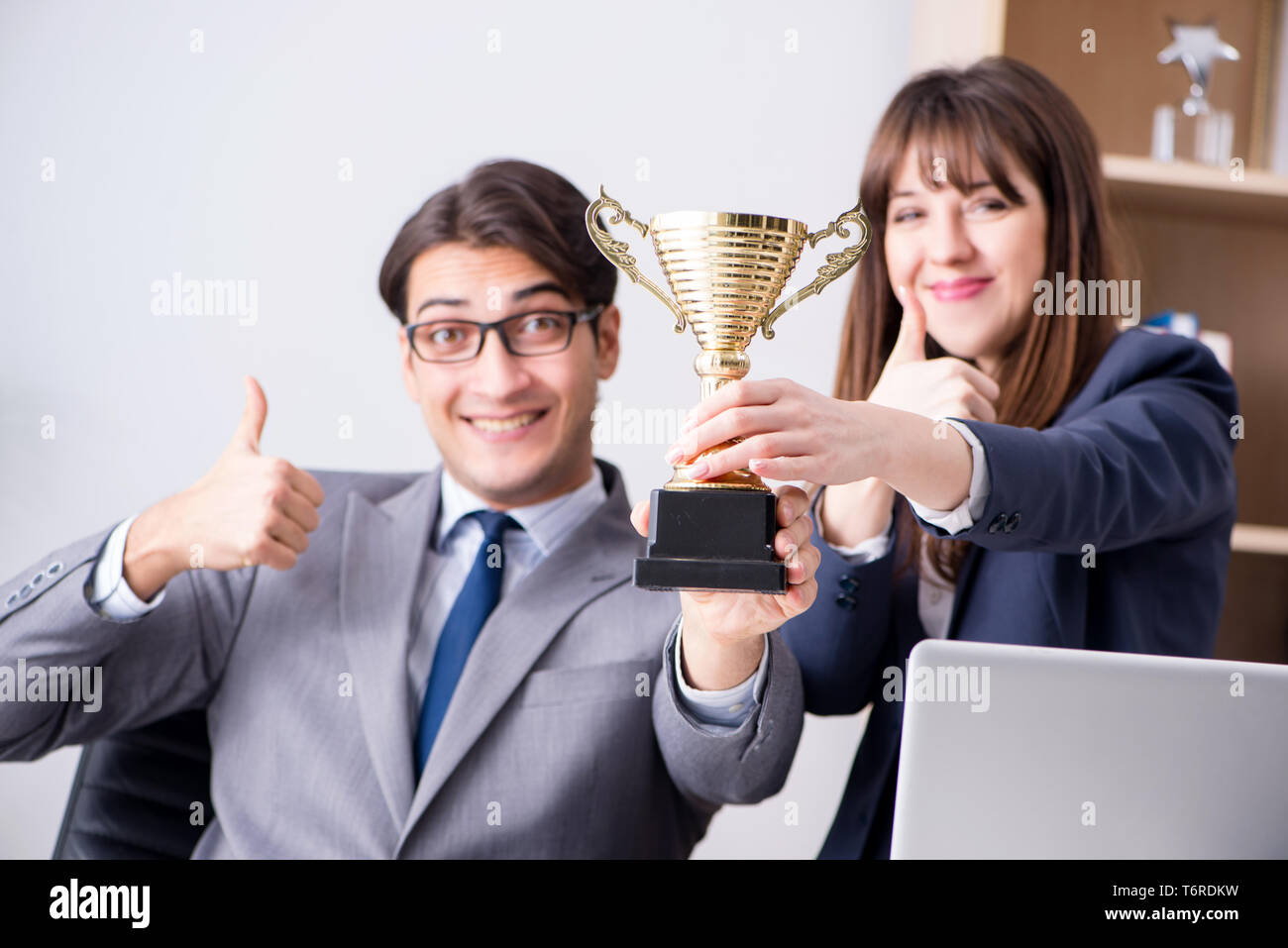 Concept of teamwork with prize Stock Photo - Alamy