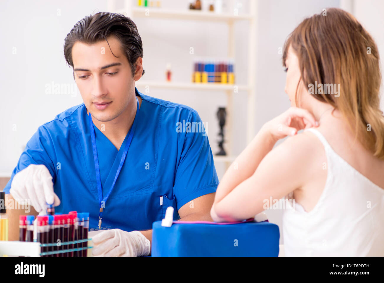 Young patient during blood test sampling procedure Stock Photo - Alamy