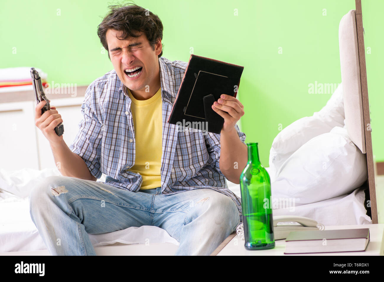 Young man sad in unhappy love concept Stock Photo - Alamy