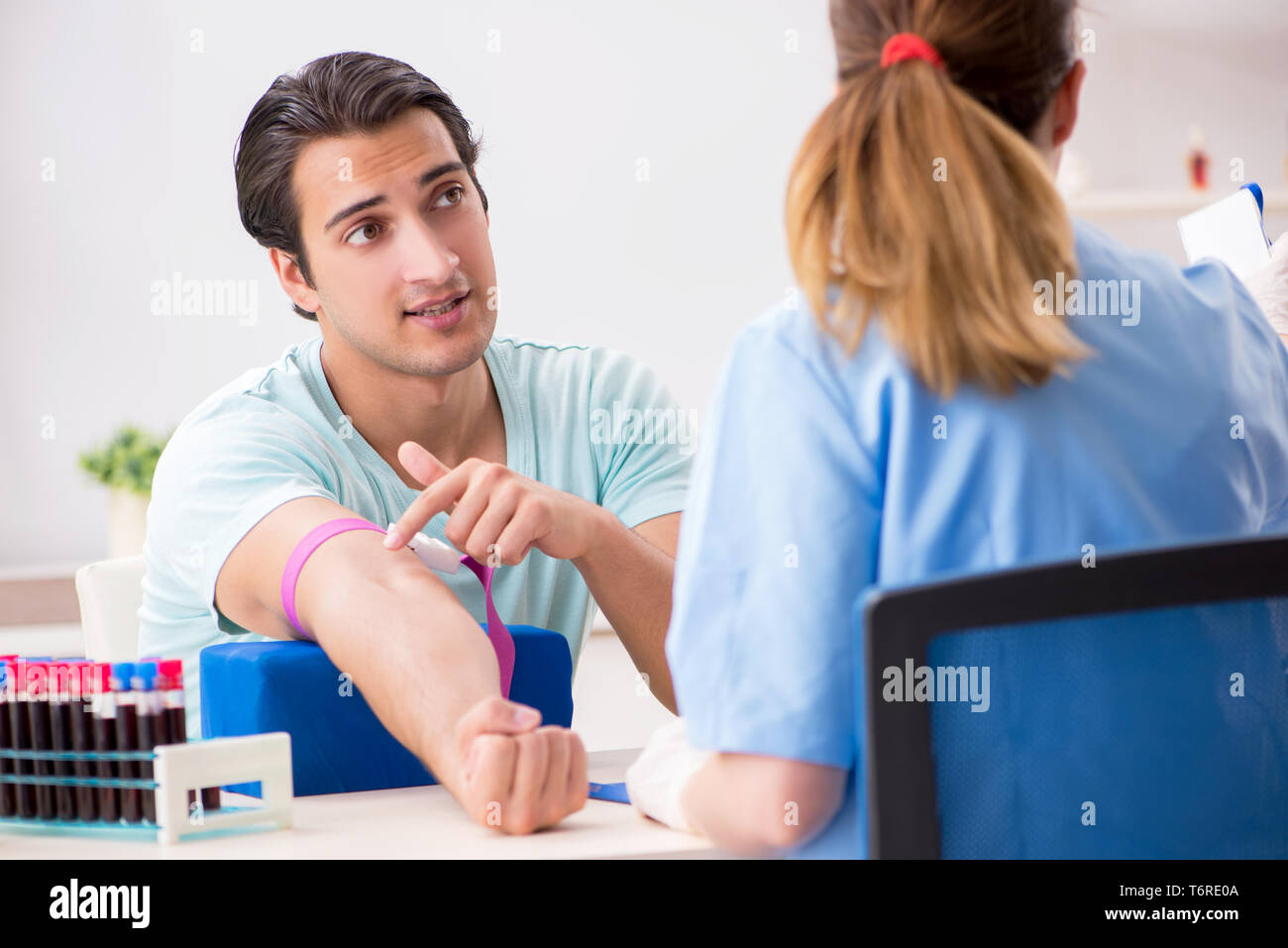 Young patient during blood test sampling procedure Stock Photo - Alamy