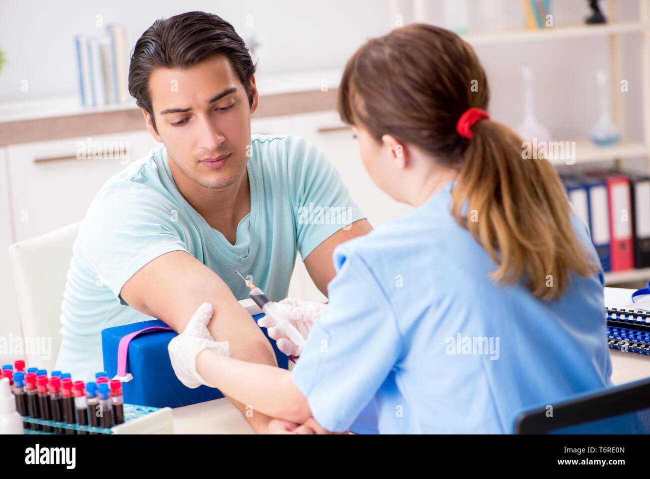 Young patient during blood test sampling procedure Stock Photo - Alamy