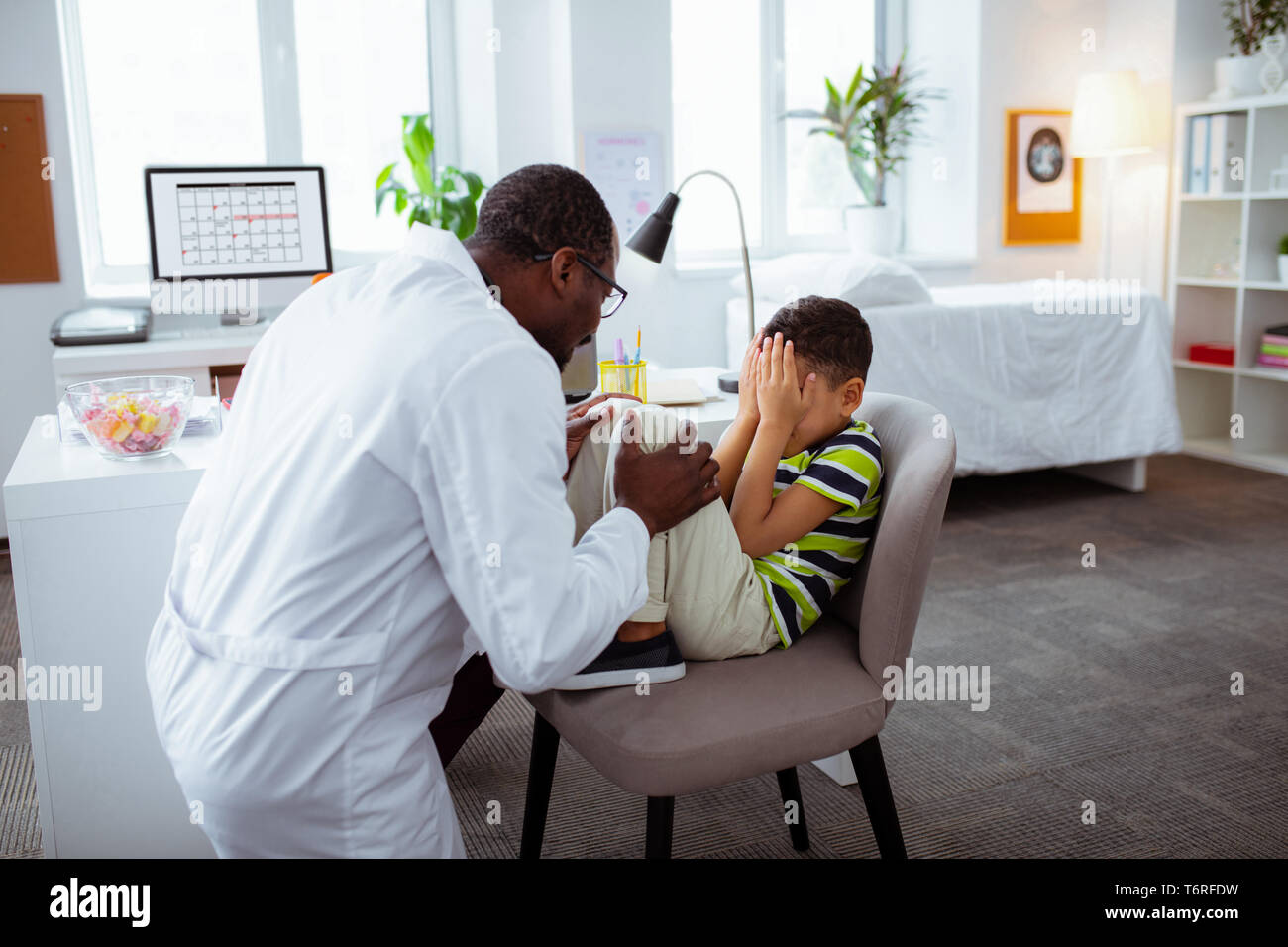 Cute boy feeling angry at father working and not playing with him Stock ...