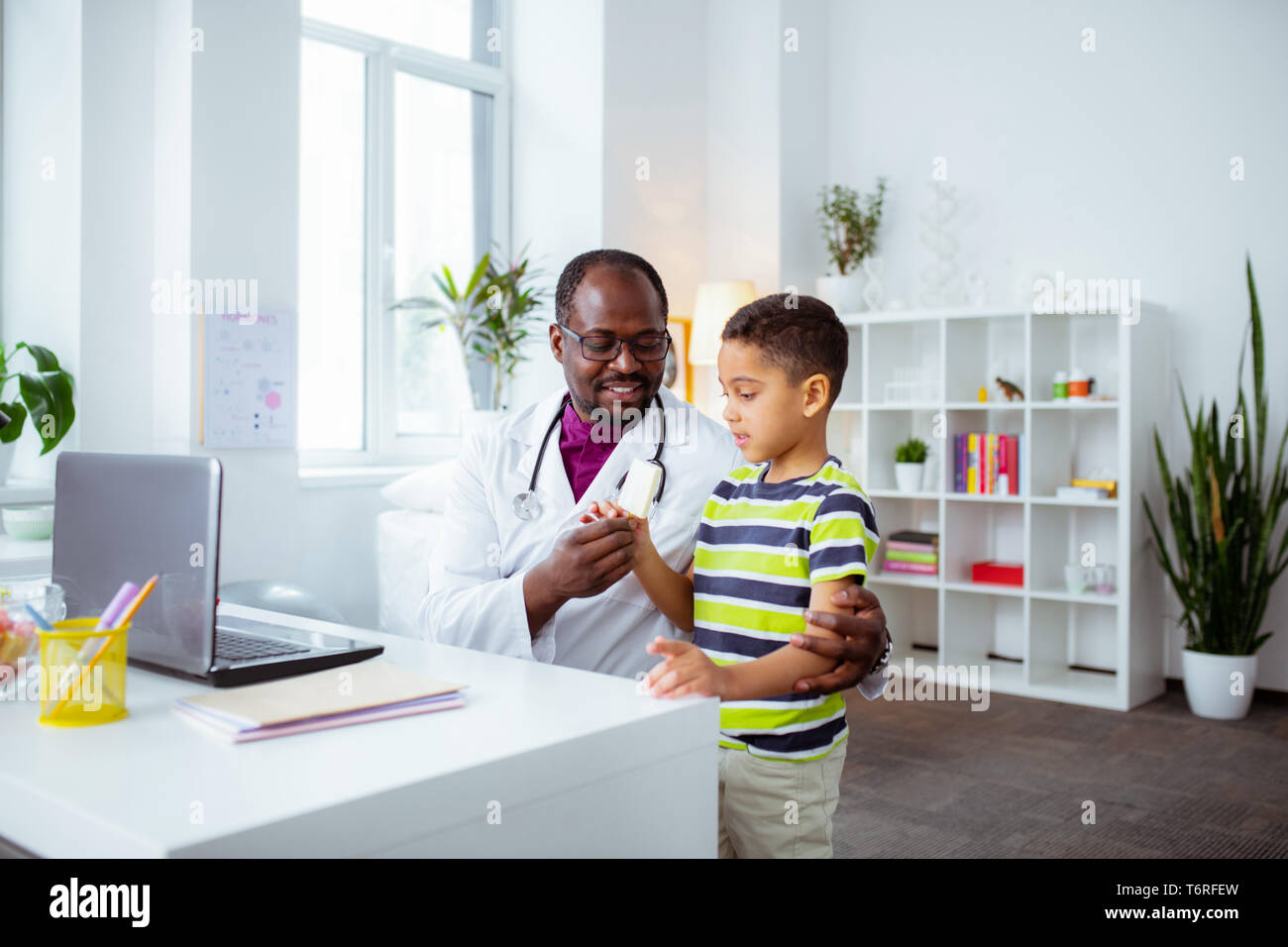 Father working as doctor giving his cute son ice cream Stock Photo - Alamy