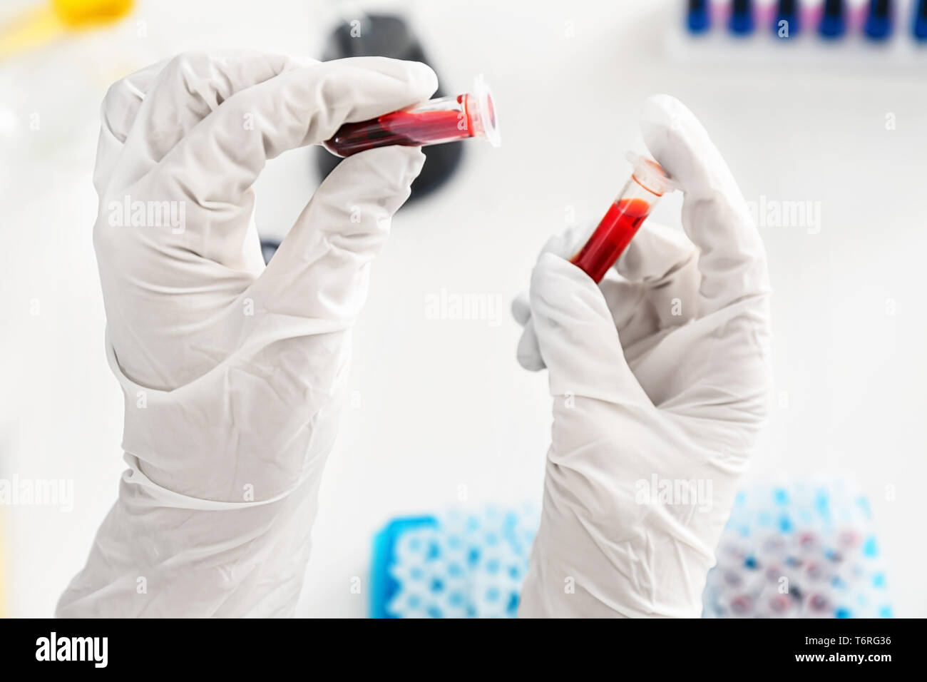 Lab worker holding test tubes with blood, closeup Stock Photo - Alamy