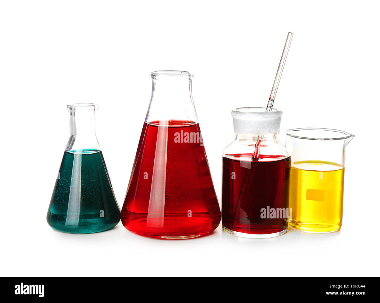 Chemical glassware with colorful liquids on white background Stock ...