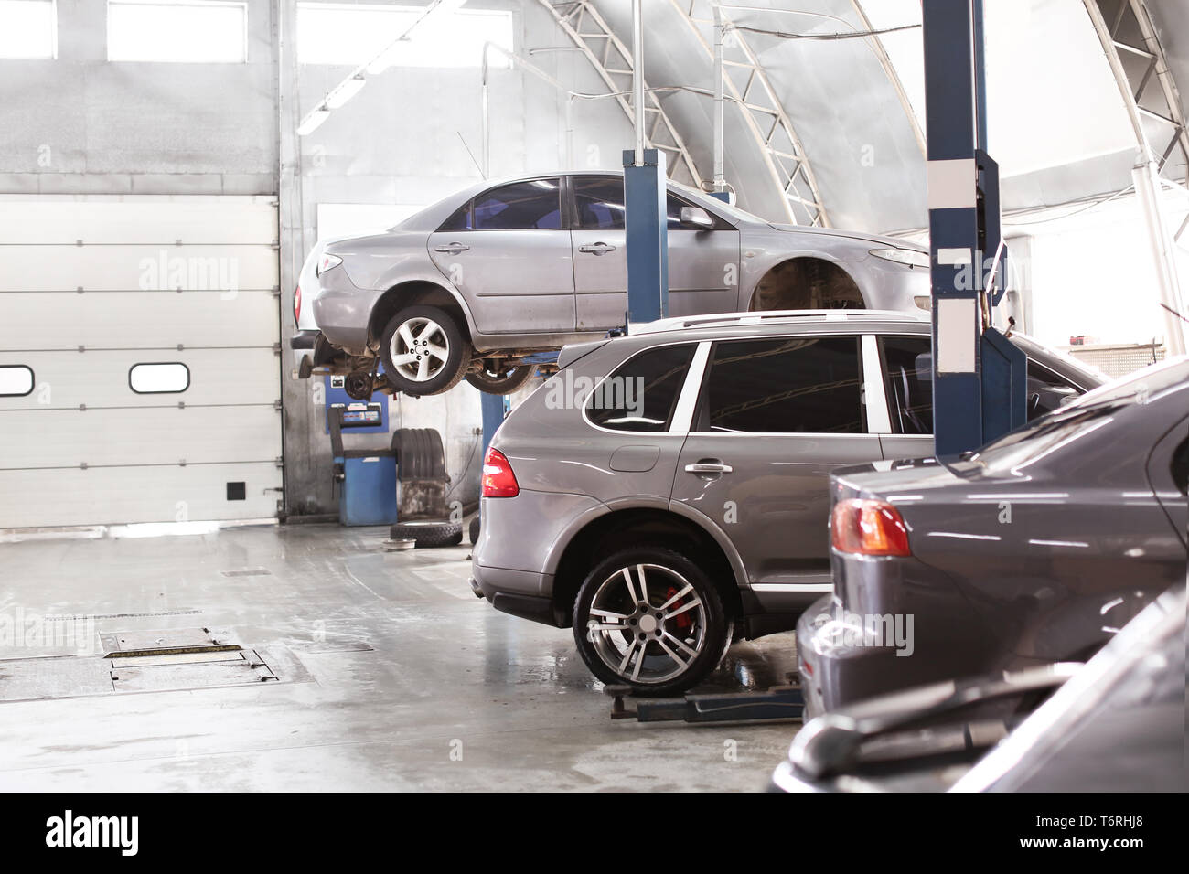 Interior of car service center with automobiles Stock Photo - Alamy