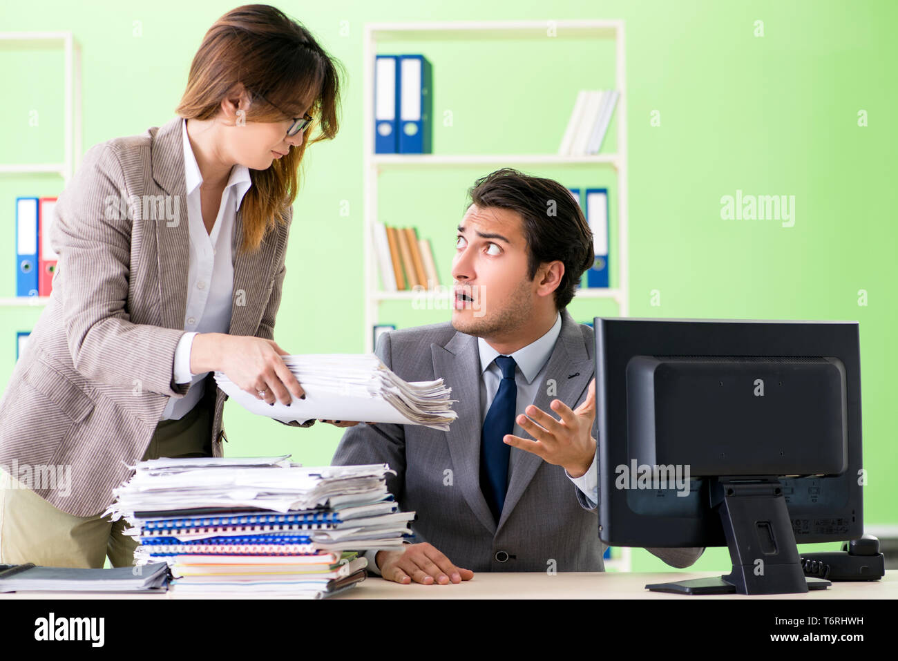 Man employee suffering from excessive work Stock Photo - Alamy