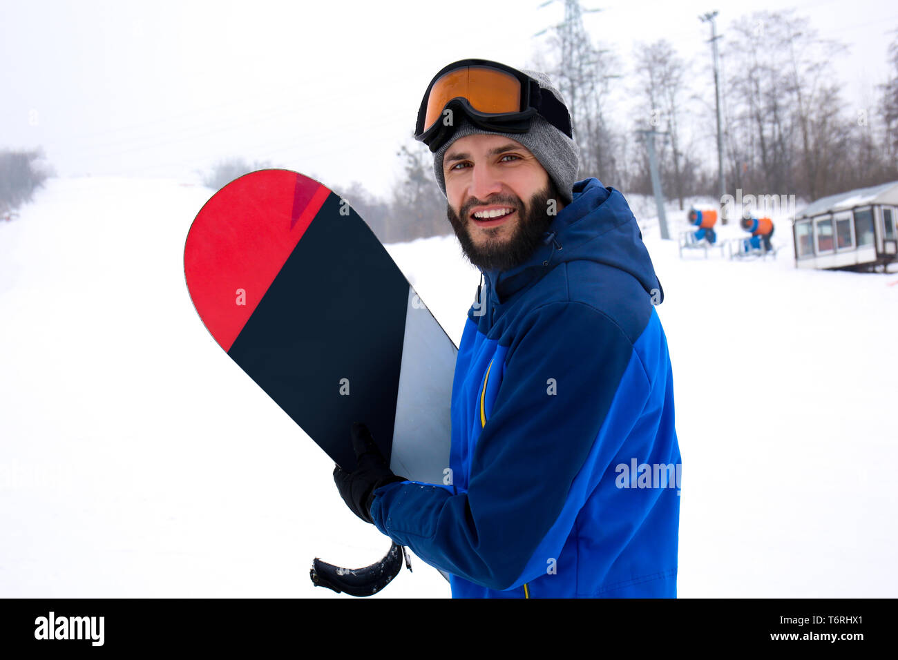 Male snowboarder on slope at winter resort Stock Photo - Alamy