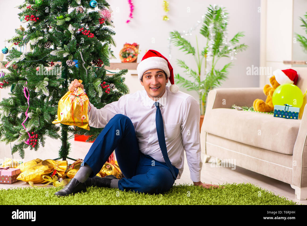 Employee businessman celebrating christmas in office Stock Photo - Alamy