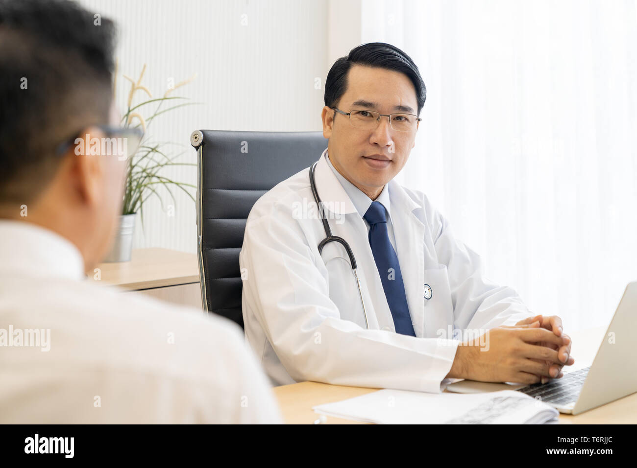 Doctor portrait in medical office Stock Photo - Alamy