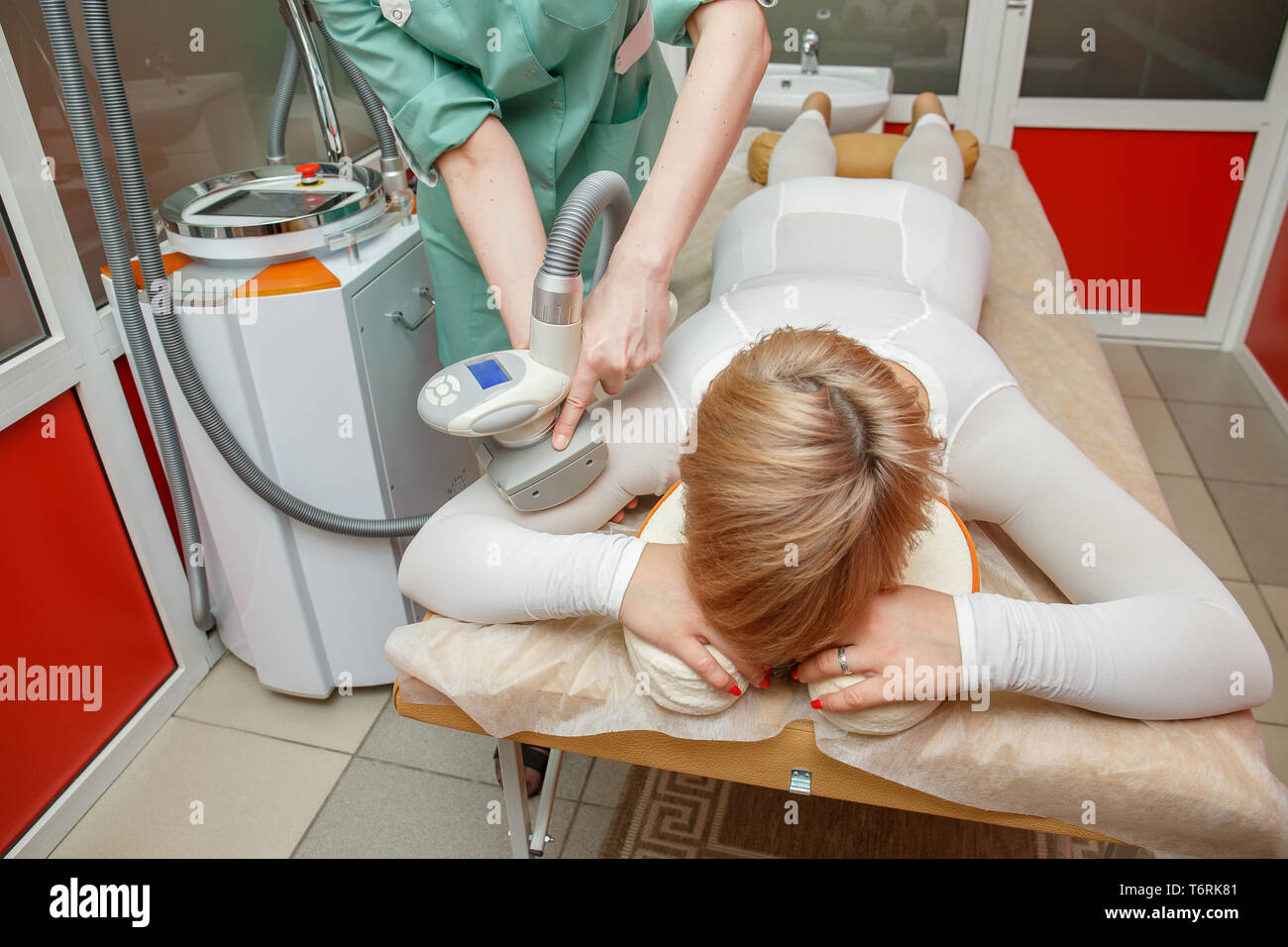 Woman Having Anti Cellulite Lpg Massage Treatment With Apparatus In