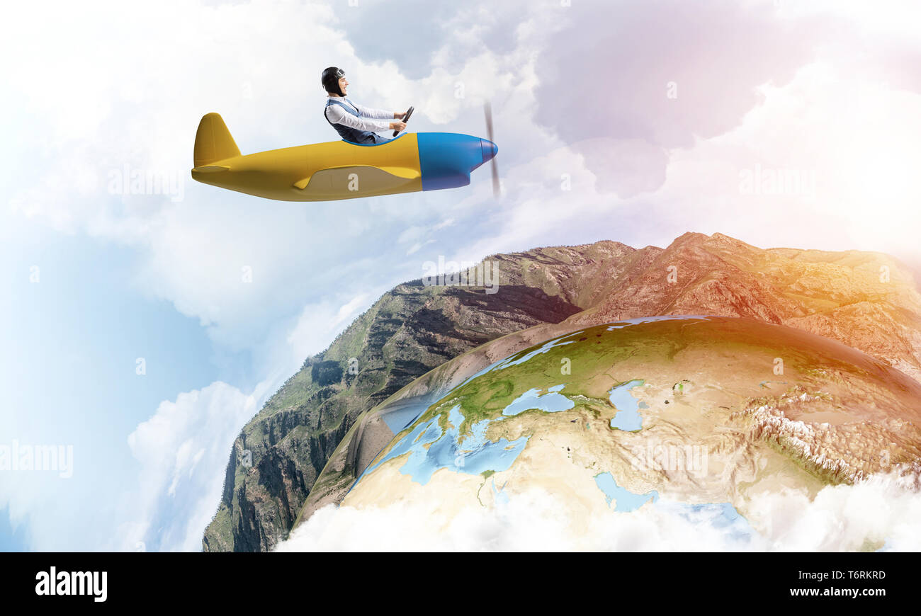 Happy pilot driving small propeller plane Stock Photo - Alamy