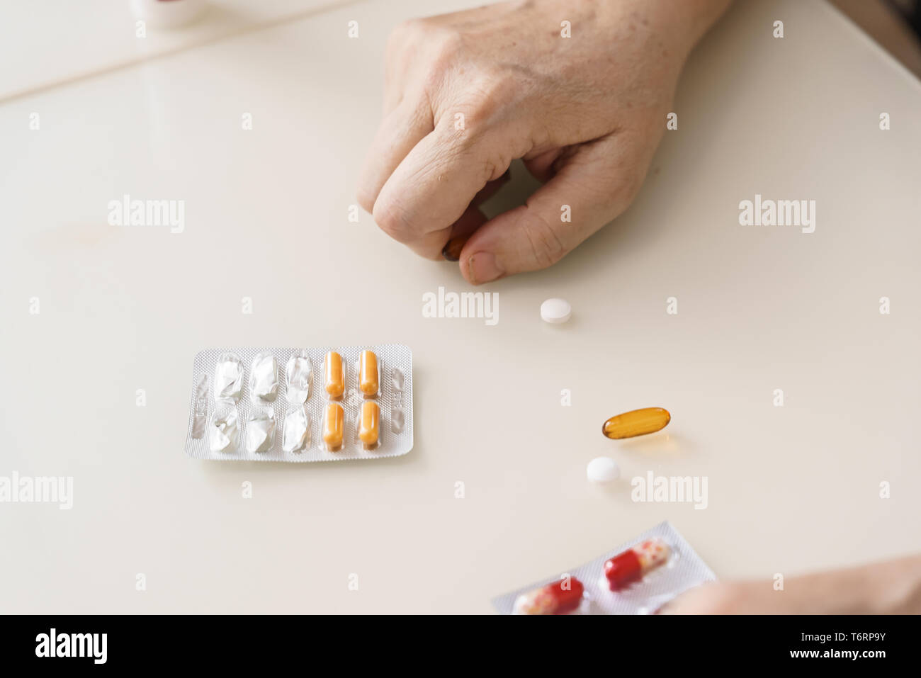 Omega capsules on hand business hi-res stock photography and images - Alamy