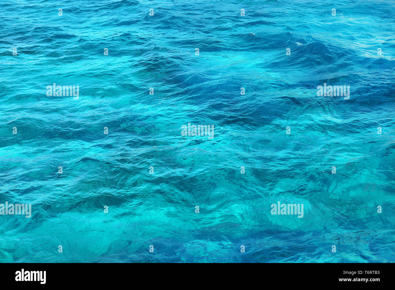 Transparent blue sea water natural background Stock Photo - Alamy