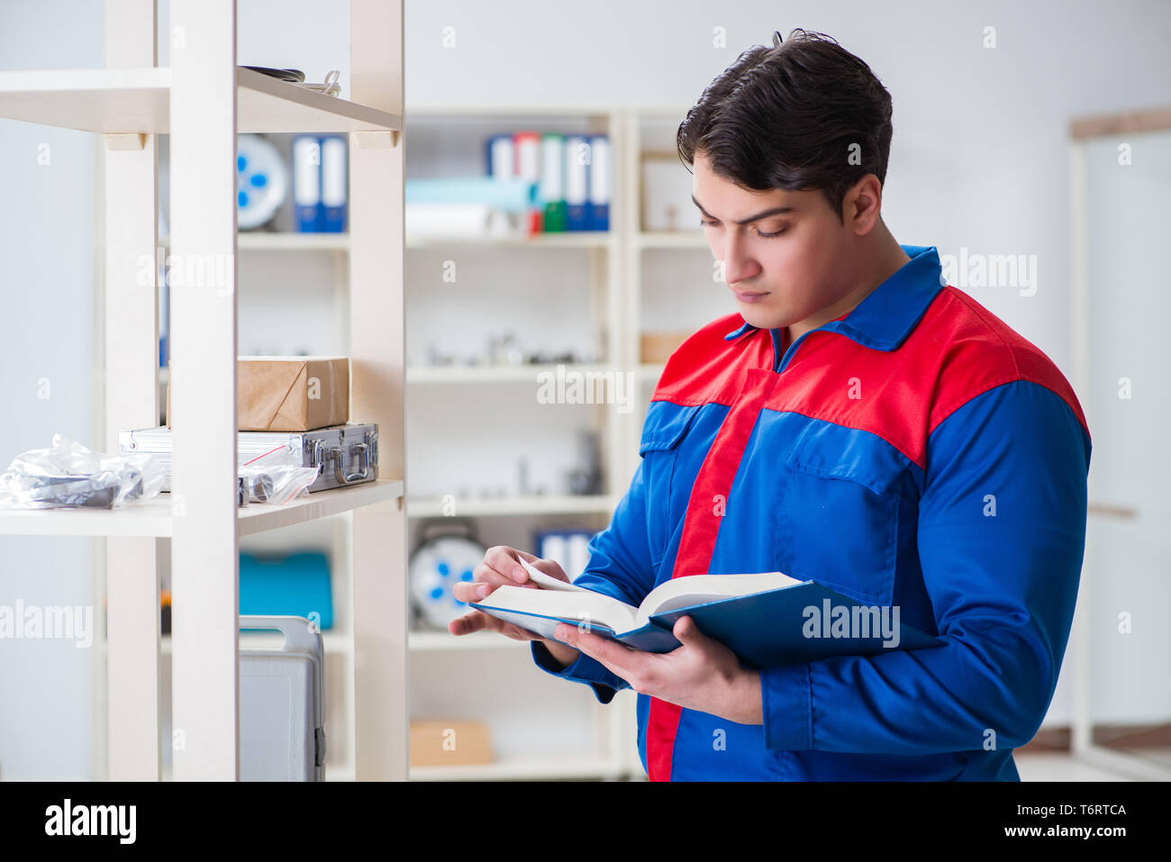 Man working in the postal warehouse Stock Photo - Alamy