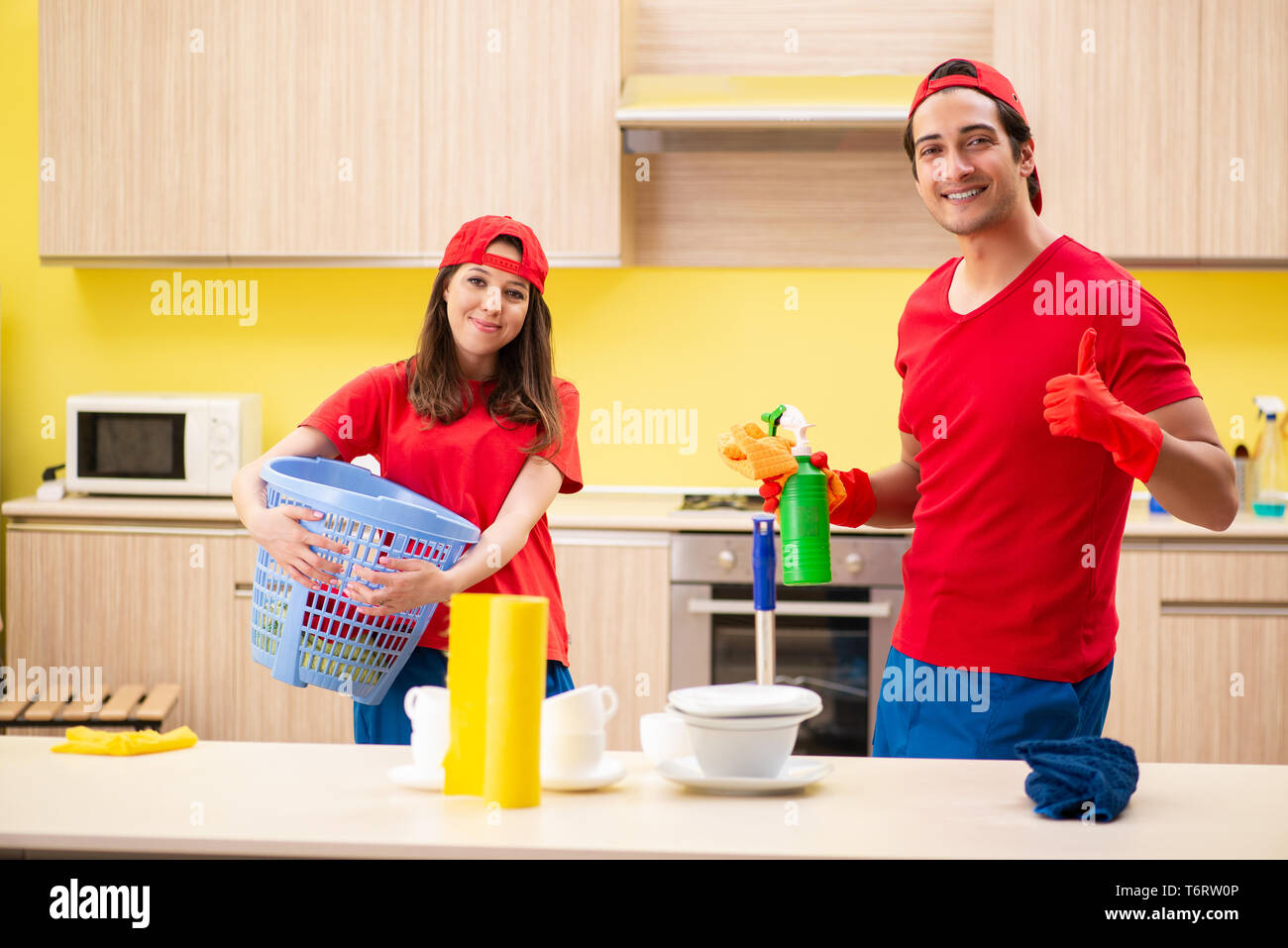 Cleaning professional contractors working at kitchen Stock Photo - Alamy