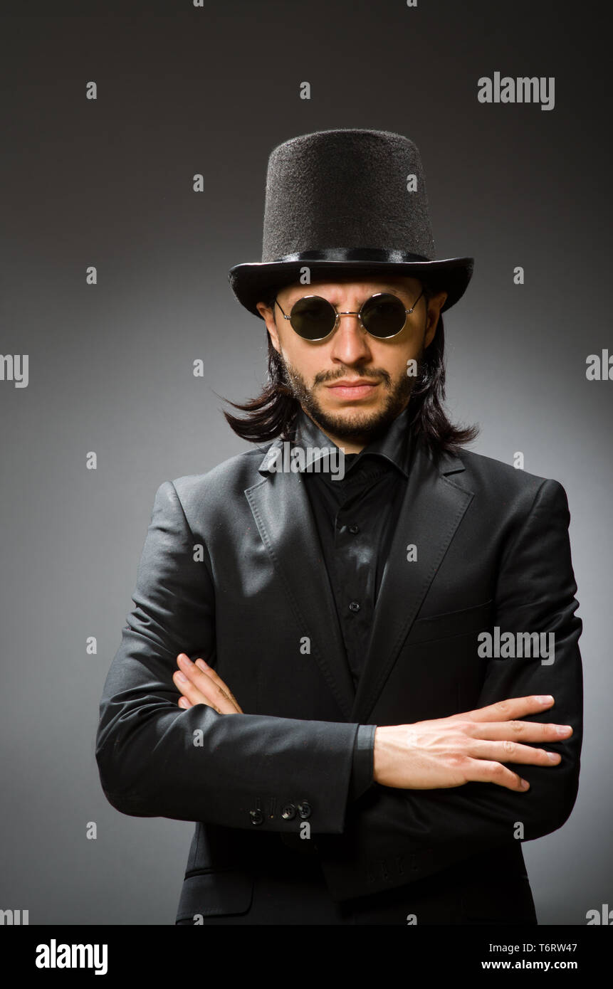 Vintage concept with man wearing black top hat Stock Photo - Alamy