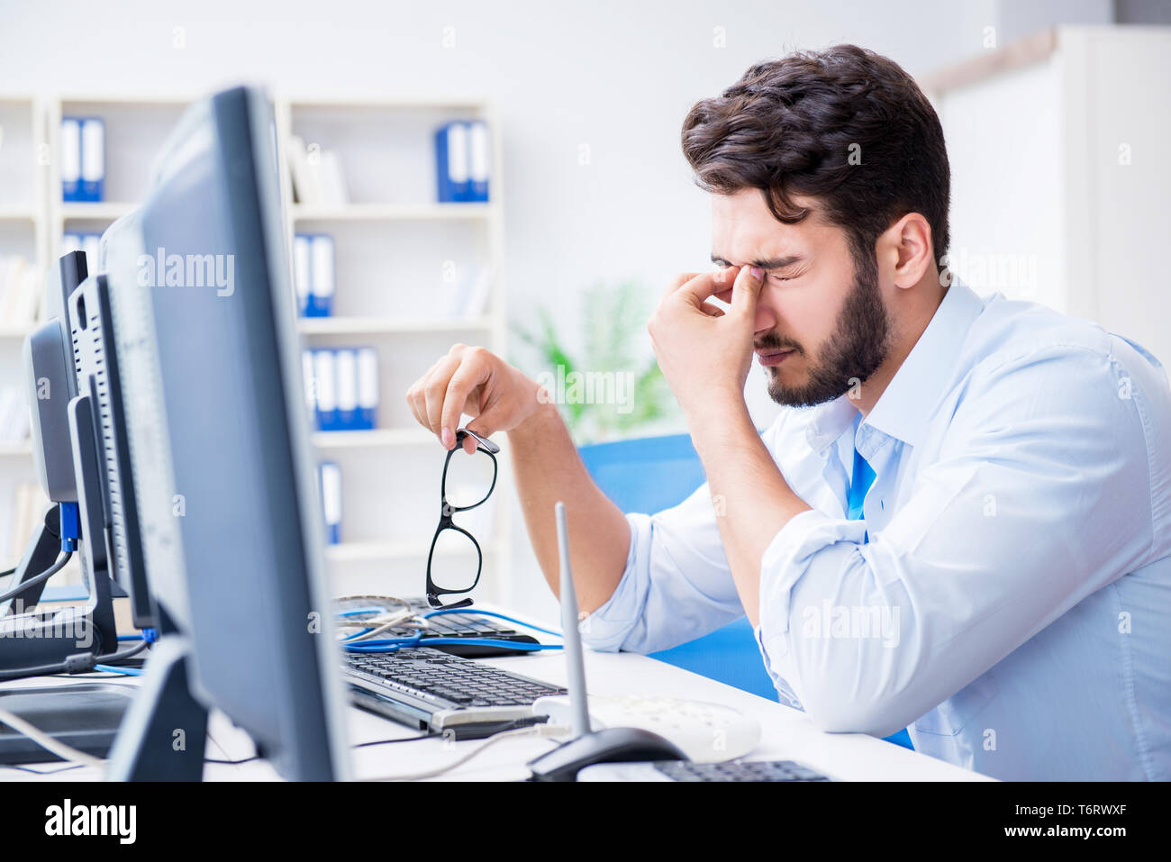 Security man looking at monitors hi-res stock photography and images ...