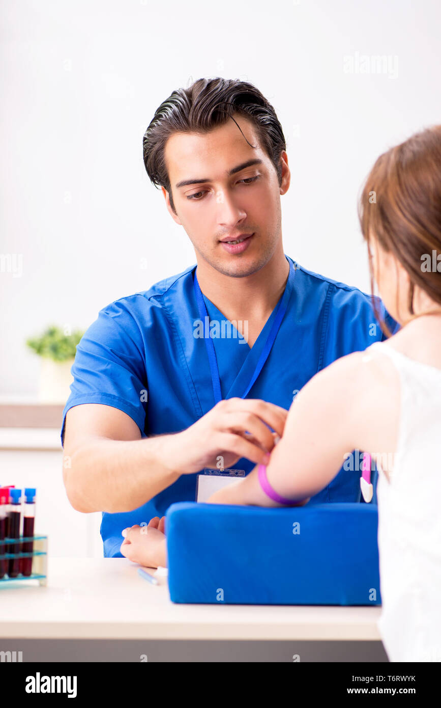 Young patient during blood test sampling procedure Stock Photo - Alamy