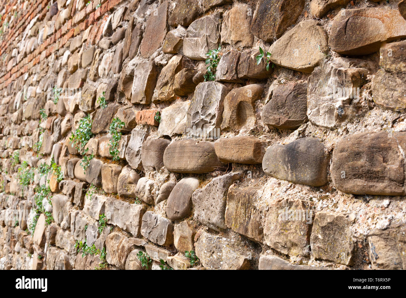 Typical ancient Italian house wall made of stones Stock Photo - Alamy