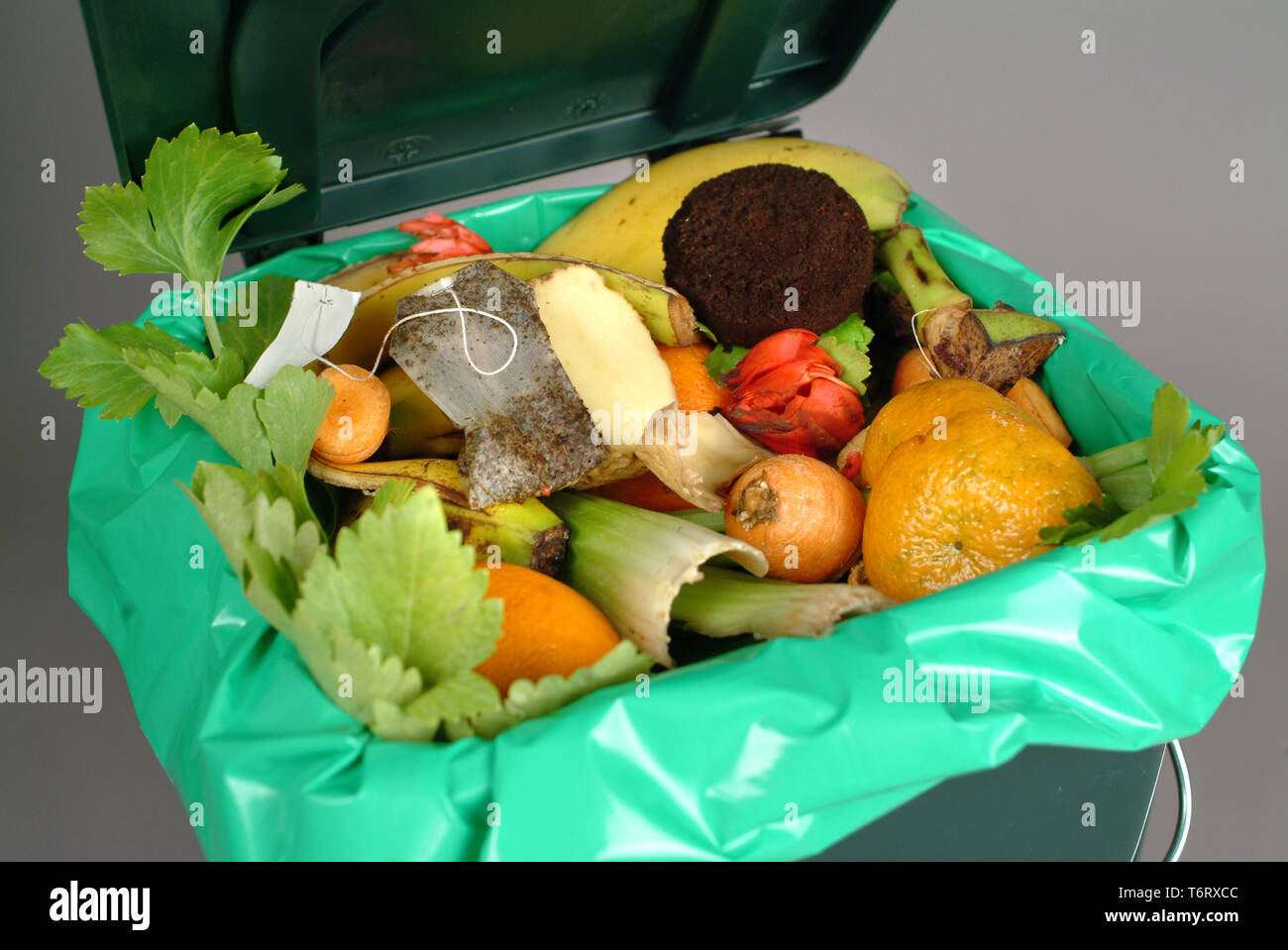 Trash bin full of organic garbage Stock Photo - Alamy