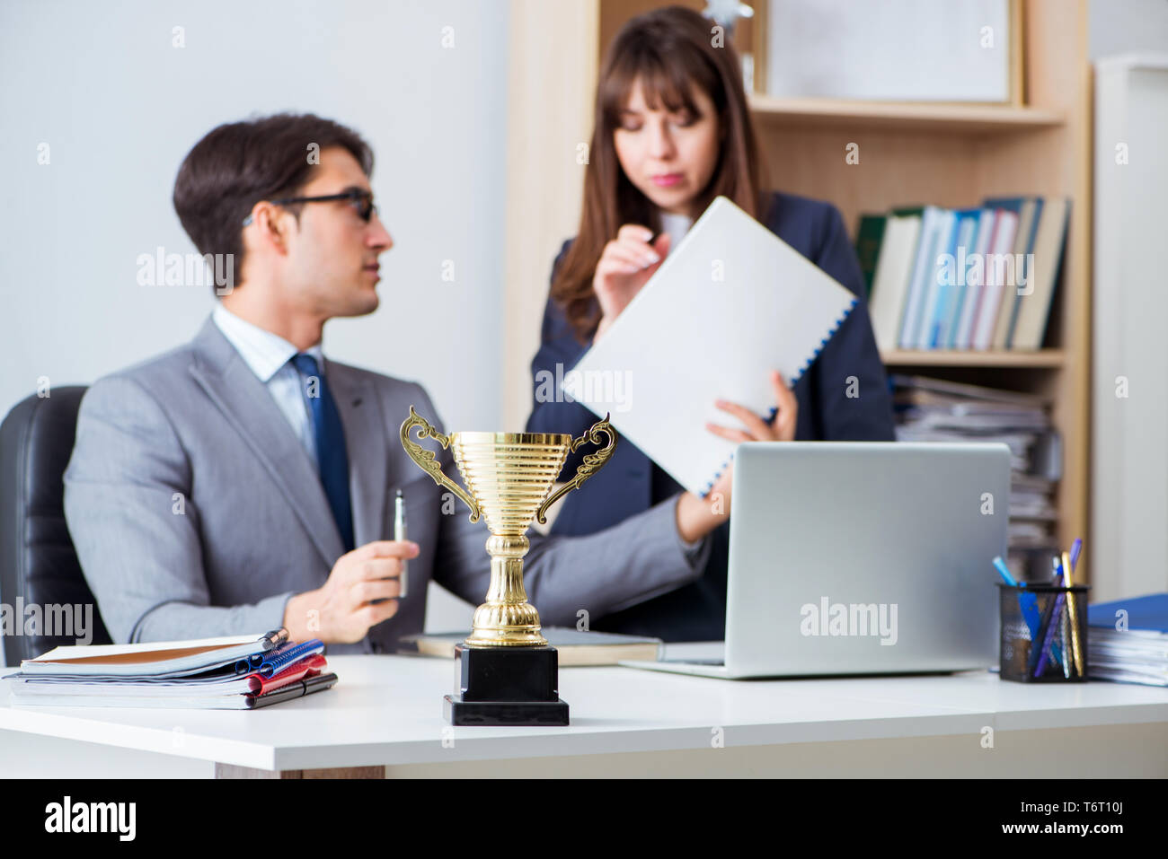 Concept of teamwork with prize Stock Photo - Alamy