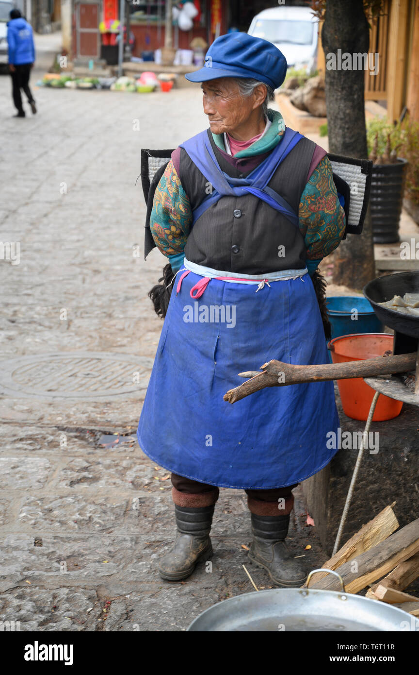 Woman in traditional costume in Baisha, near Lijiang, China Stock Photo ...