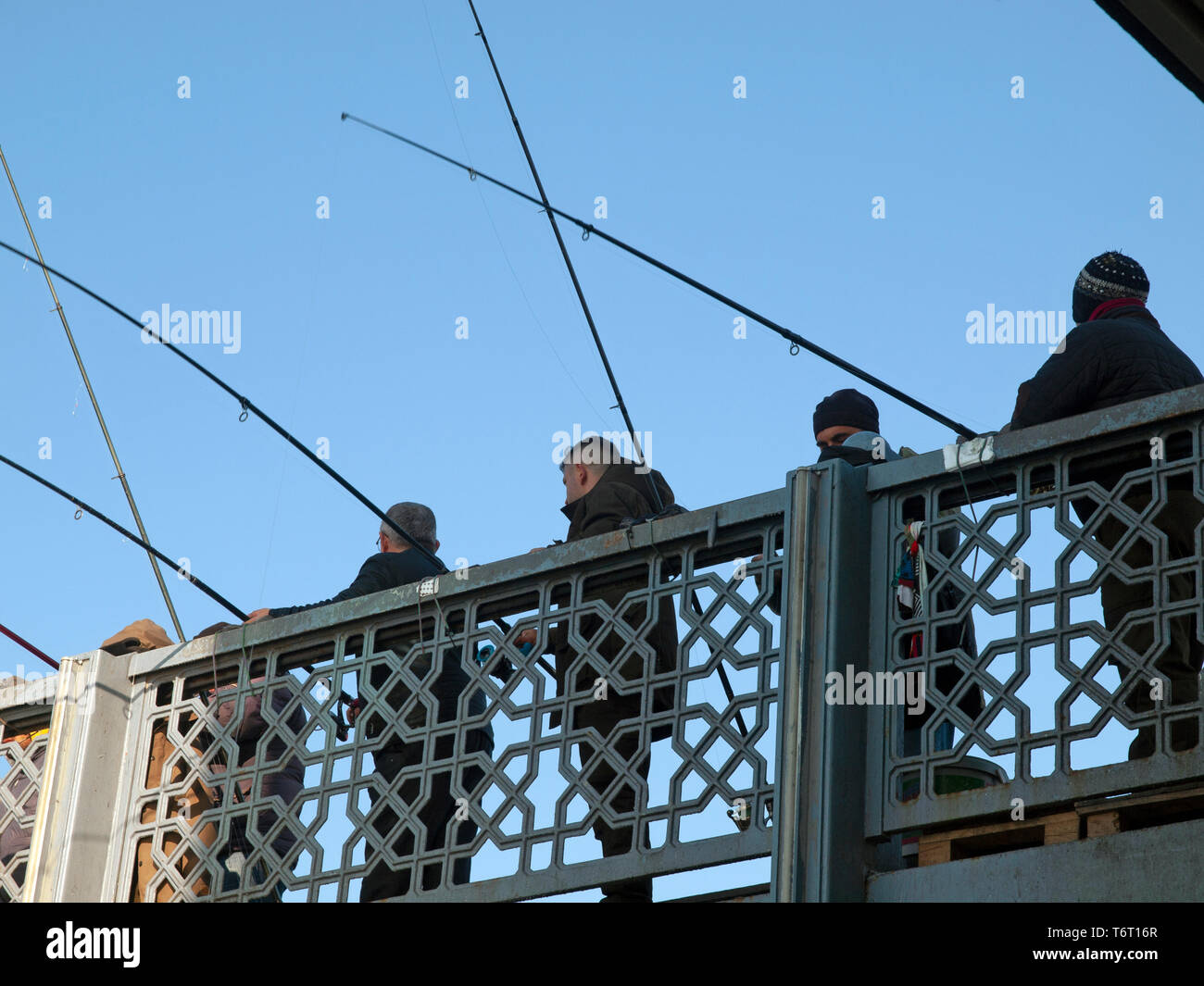 People fishing off the Galata Bridge in Istanbul Stock Photo - Alamy