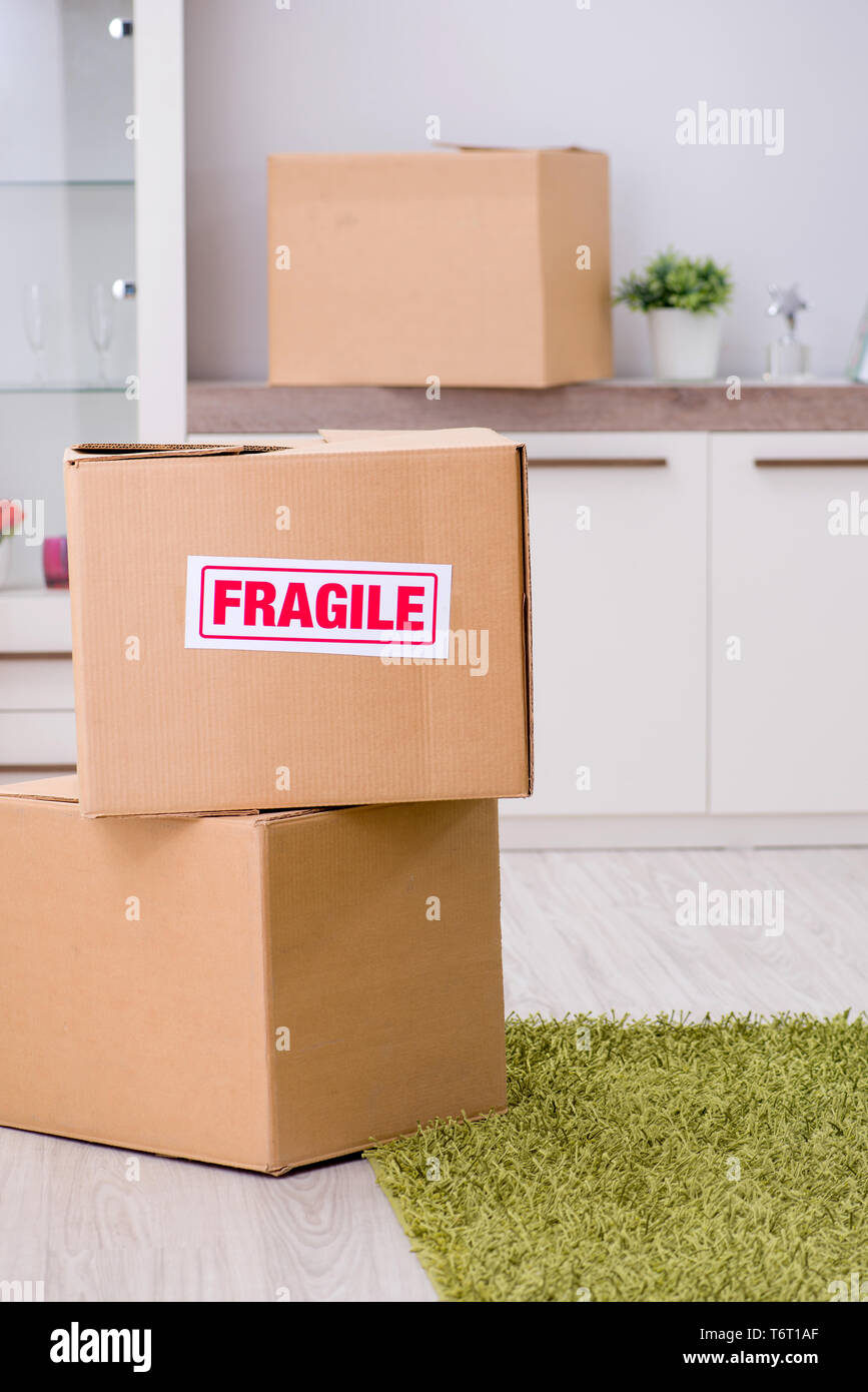 Man moving house and relocating with fragile items Stock Photo - Alamy