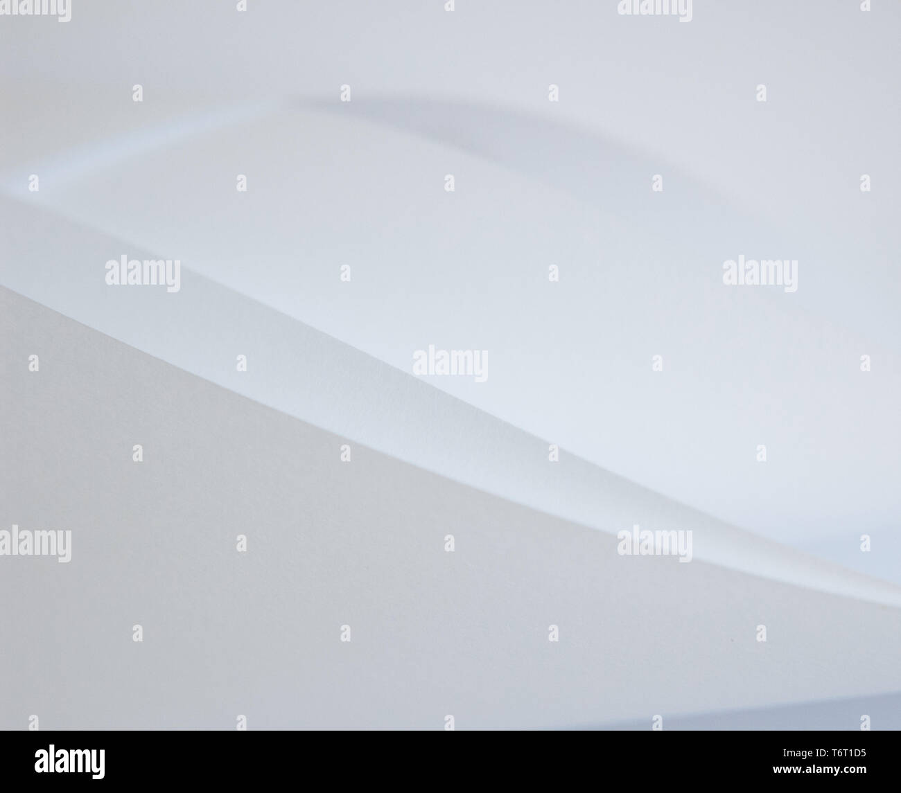 abstract background of a twisted sheet of white paper Stock Photo - Alamy