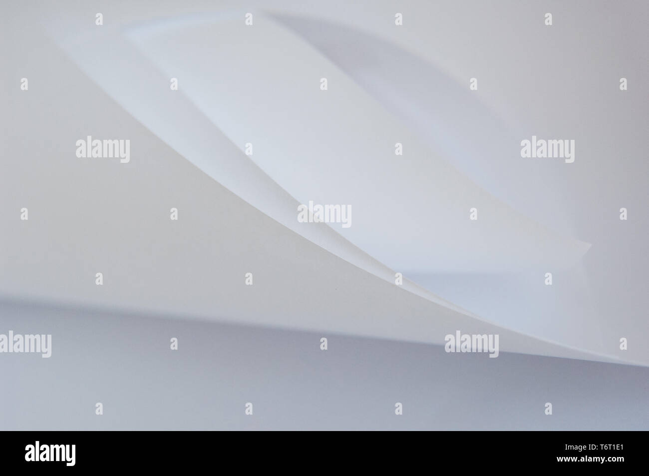 abstract background of a twisted sheet of white paper Stock Photo - Alamy