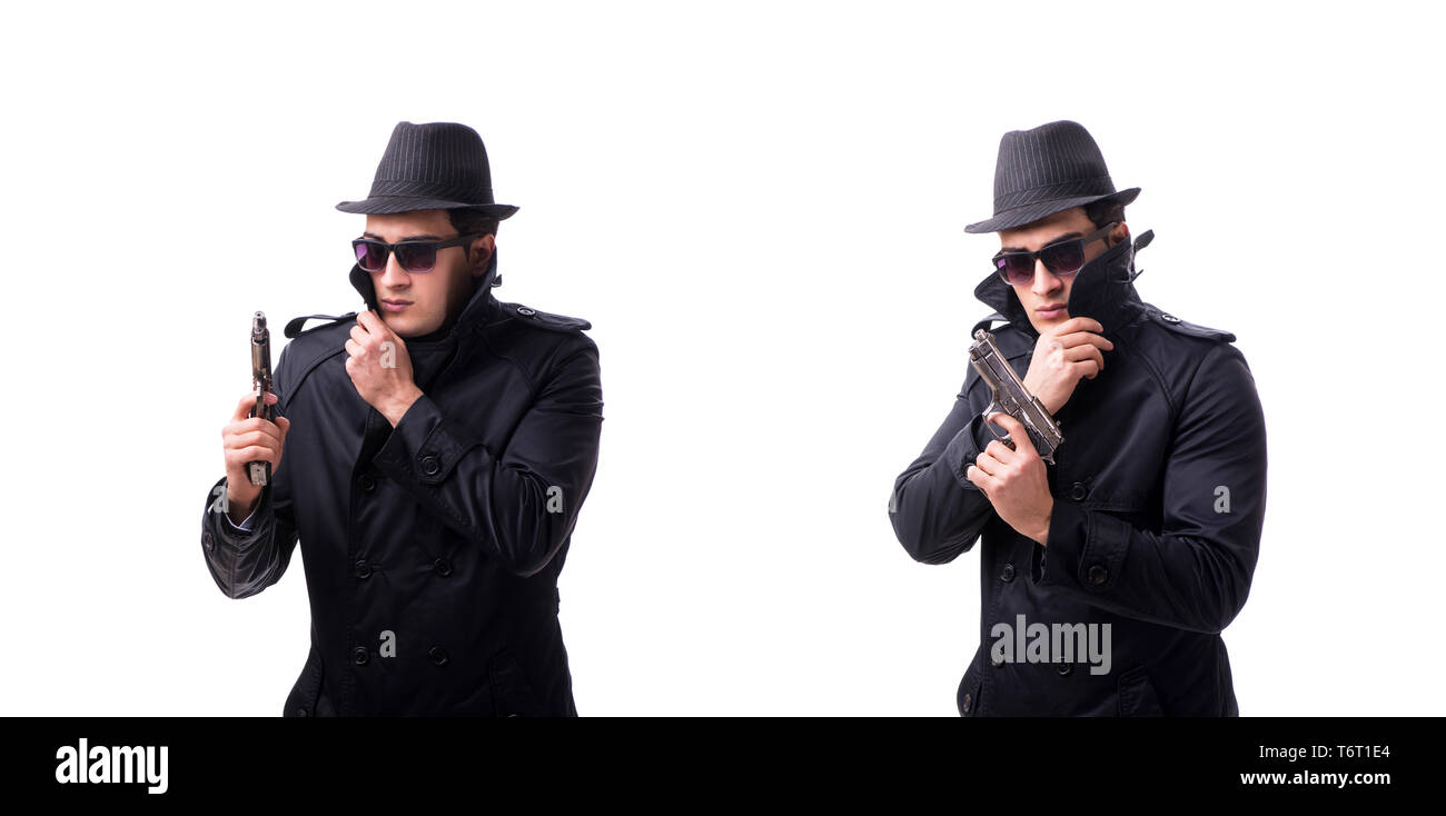 Man spy with handgun isolated on white background Stock Photo - Alamy