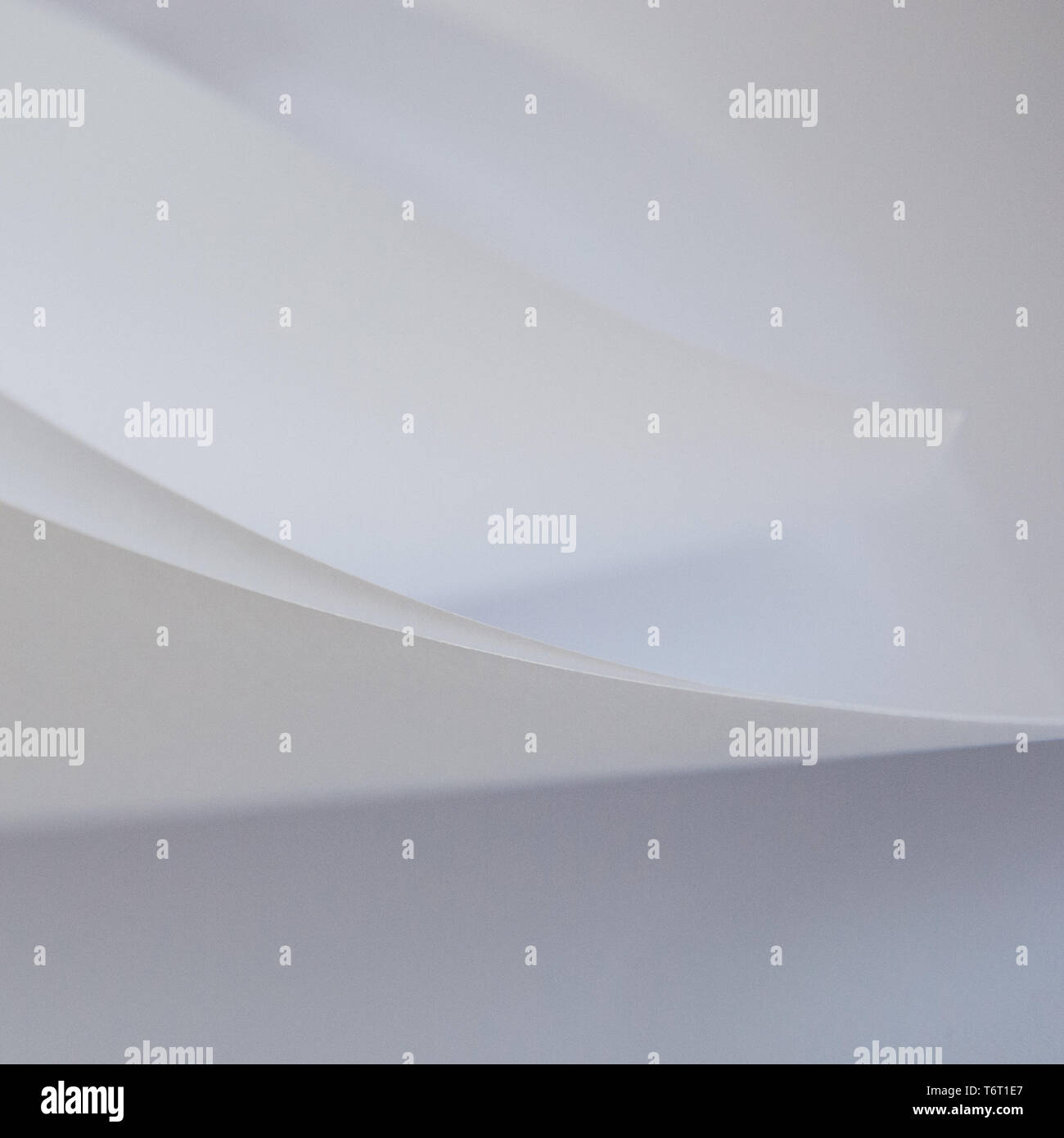 abstract background of a twisted sheet of white paper Stock Photo - Alamy