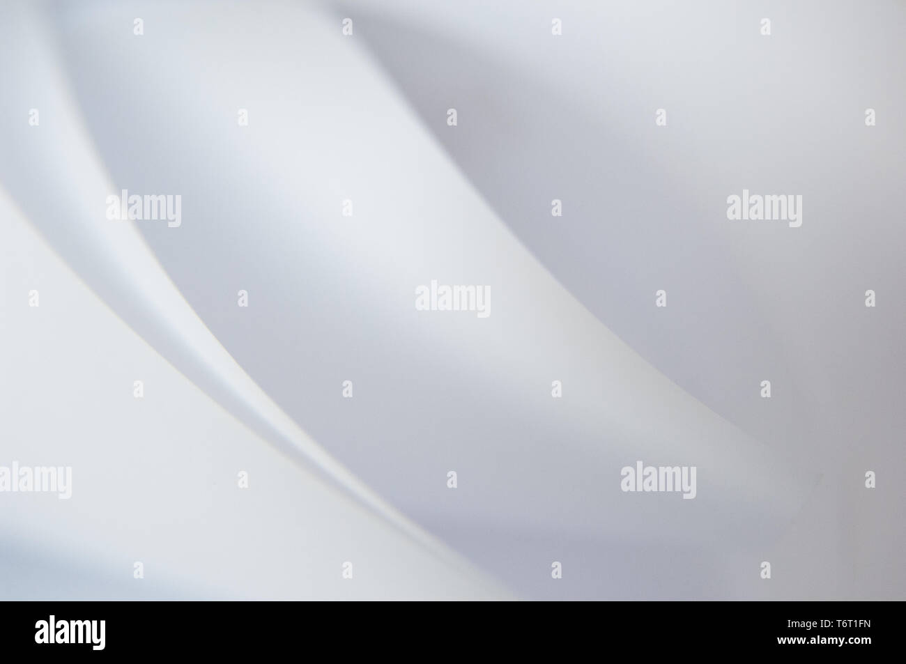 abstract background of a twisted sheet of white paper Stock Photo - Alamy