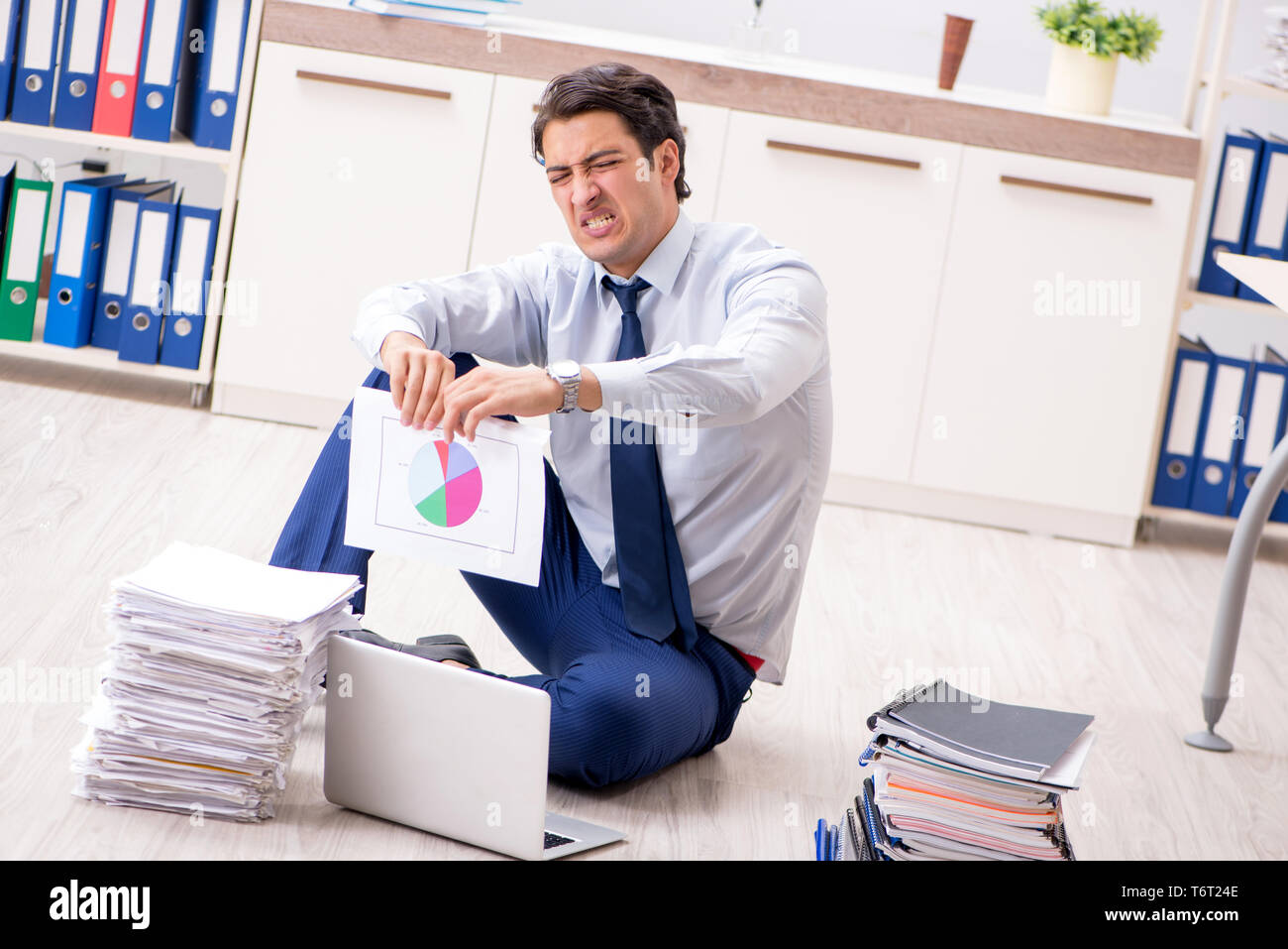 Extremely busy employee working in the office Stock Photo - Alamy