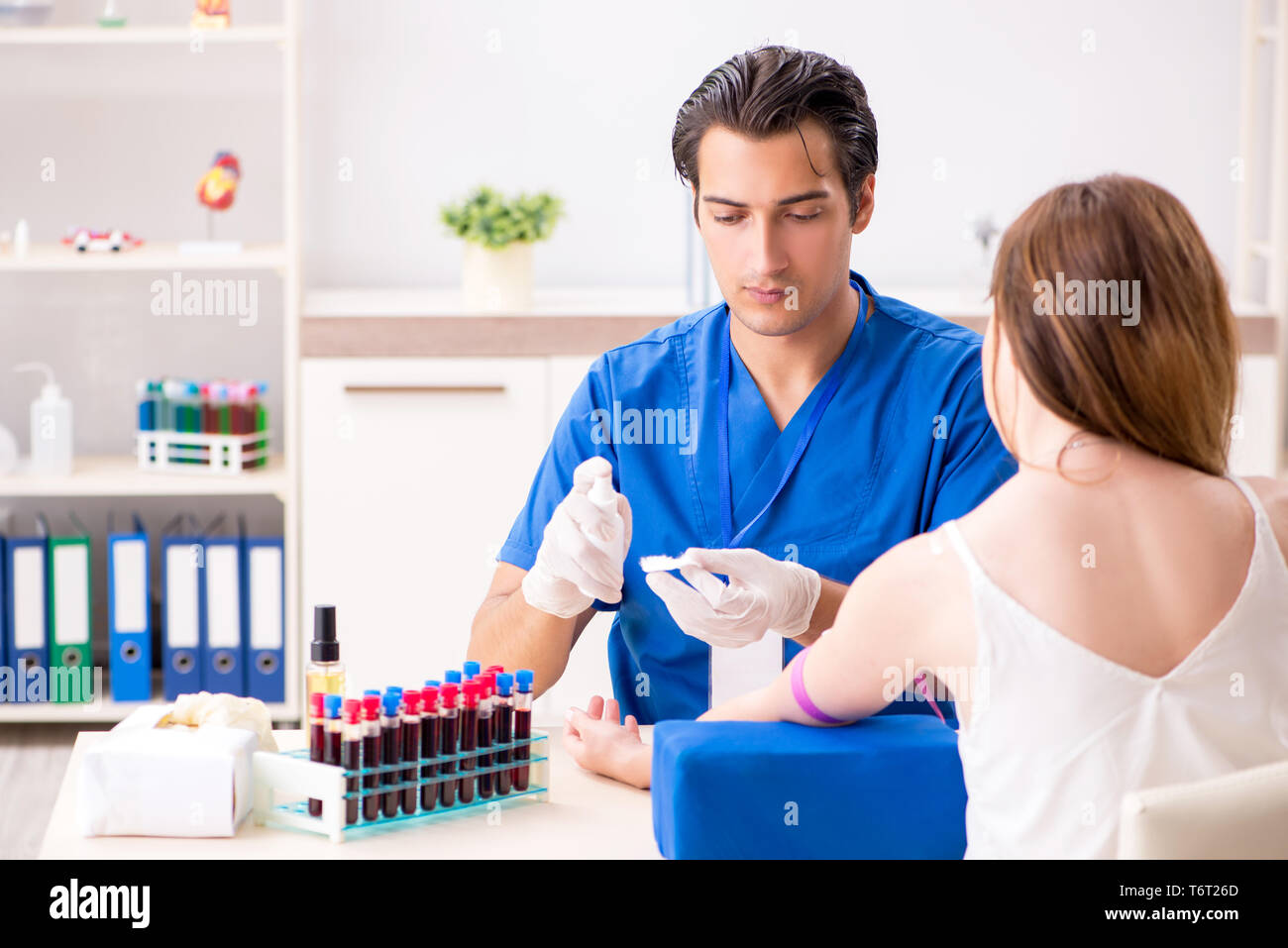 Young patient during blood test sampling procedure Stock Photo - Alamy