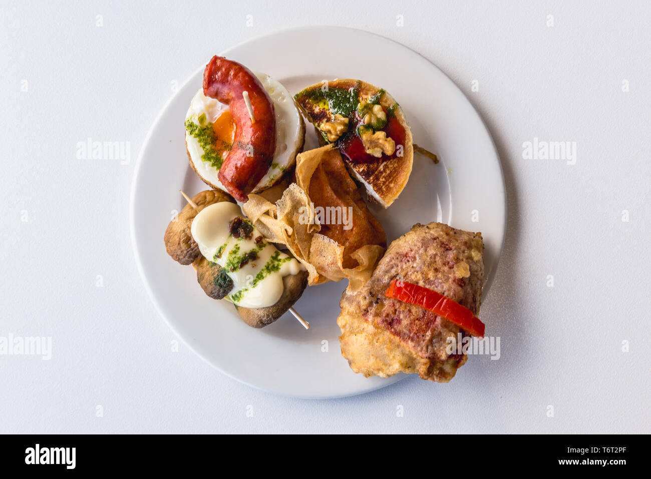 Plate of pinchos in tapas bar in San Sebastian coastal city and ...