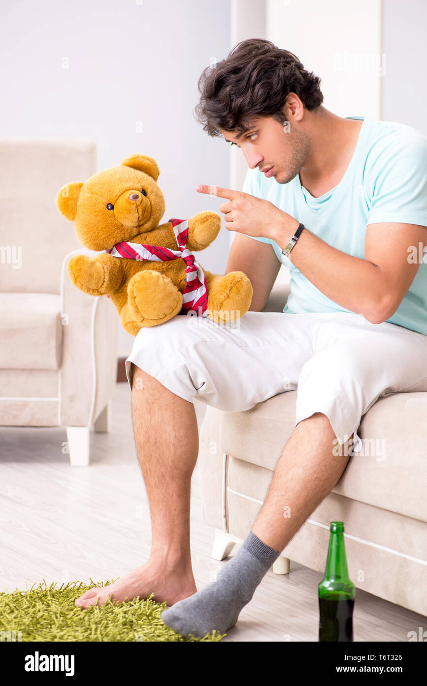 Young drunk handsome man after party at home Stock Photo - Alamy