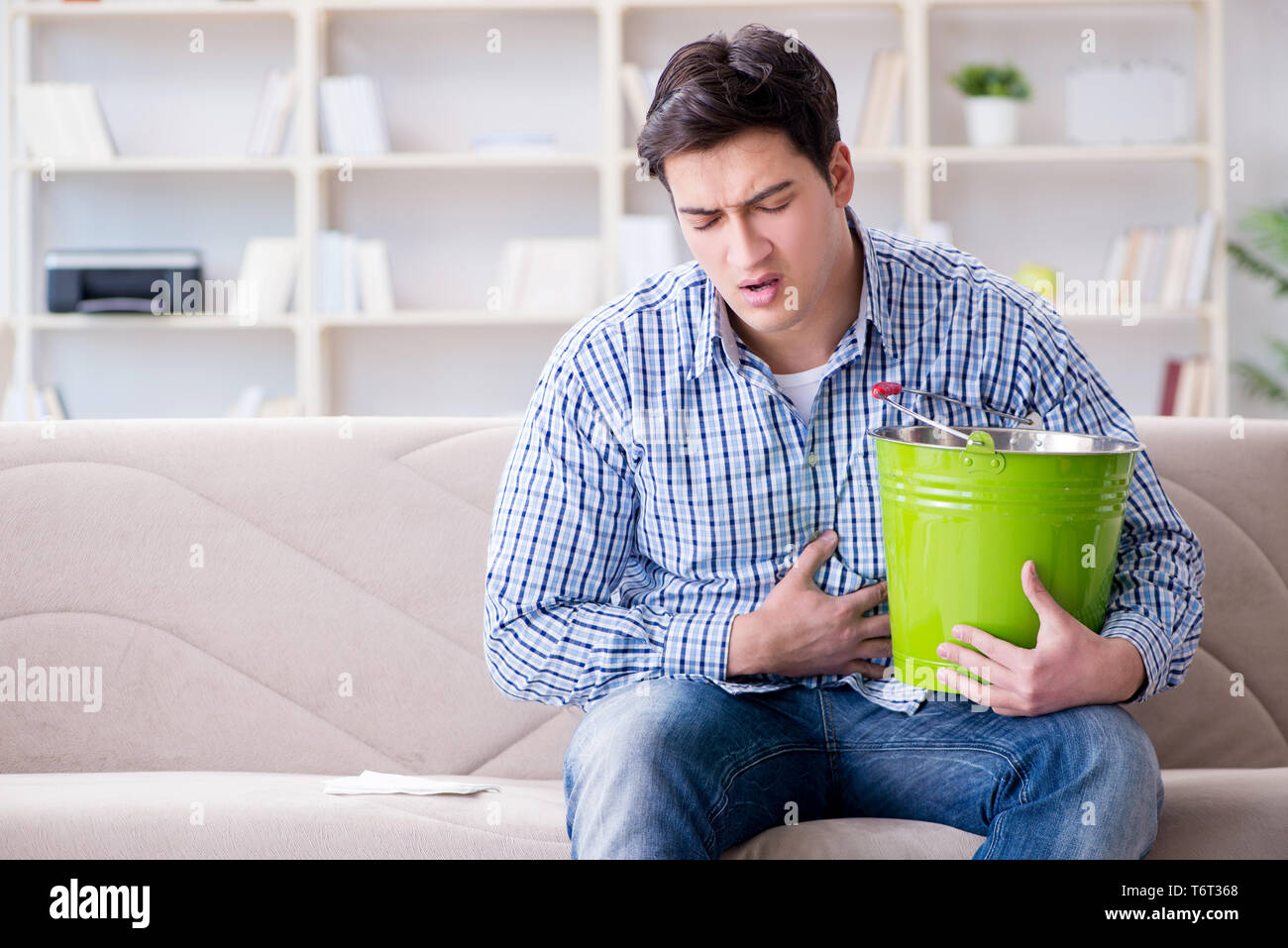 Sick man suffering at home from infection and bad stomach Stock Photo ...