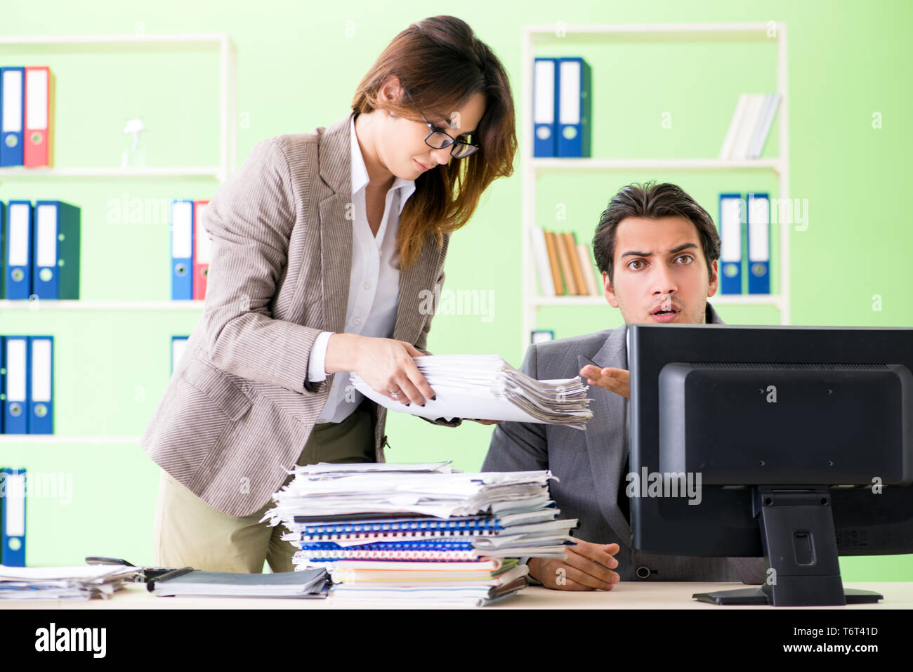 Man employee suffering from excessive work Stock Photo - Alamy