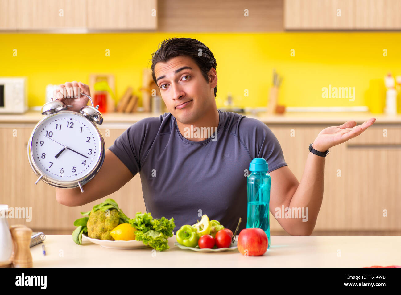 Young man in dieting and healthy eating concept Stock Photo - Alamy