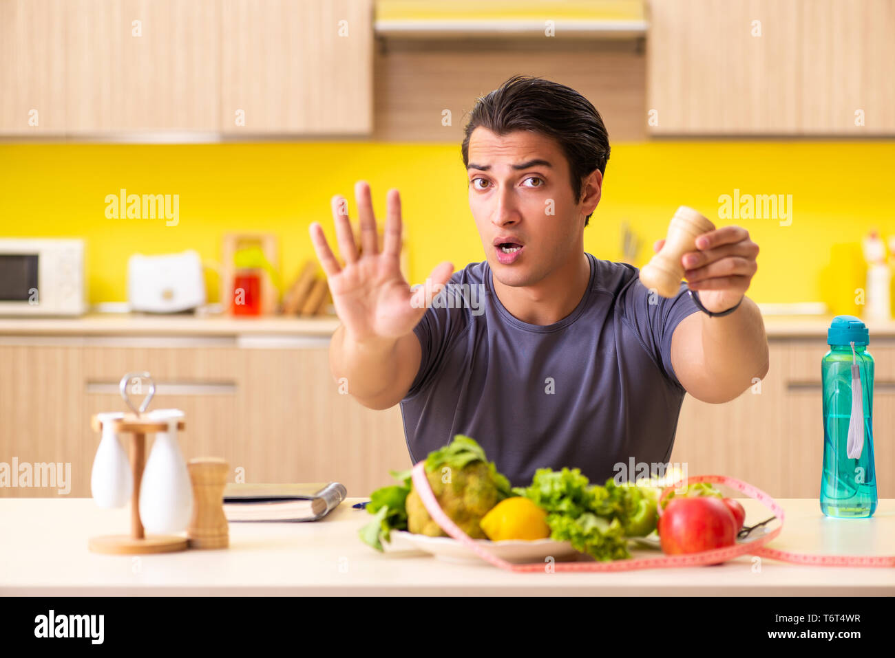 Young man in dieting and healthy eating concept Stock Photo - Alamy
