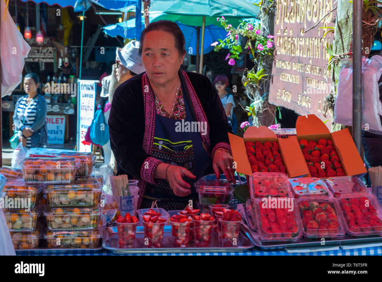 Chiang Mai, Thailand - Dec 2015: Lady selling strawberries at local ...