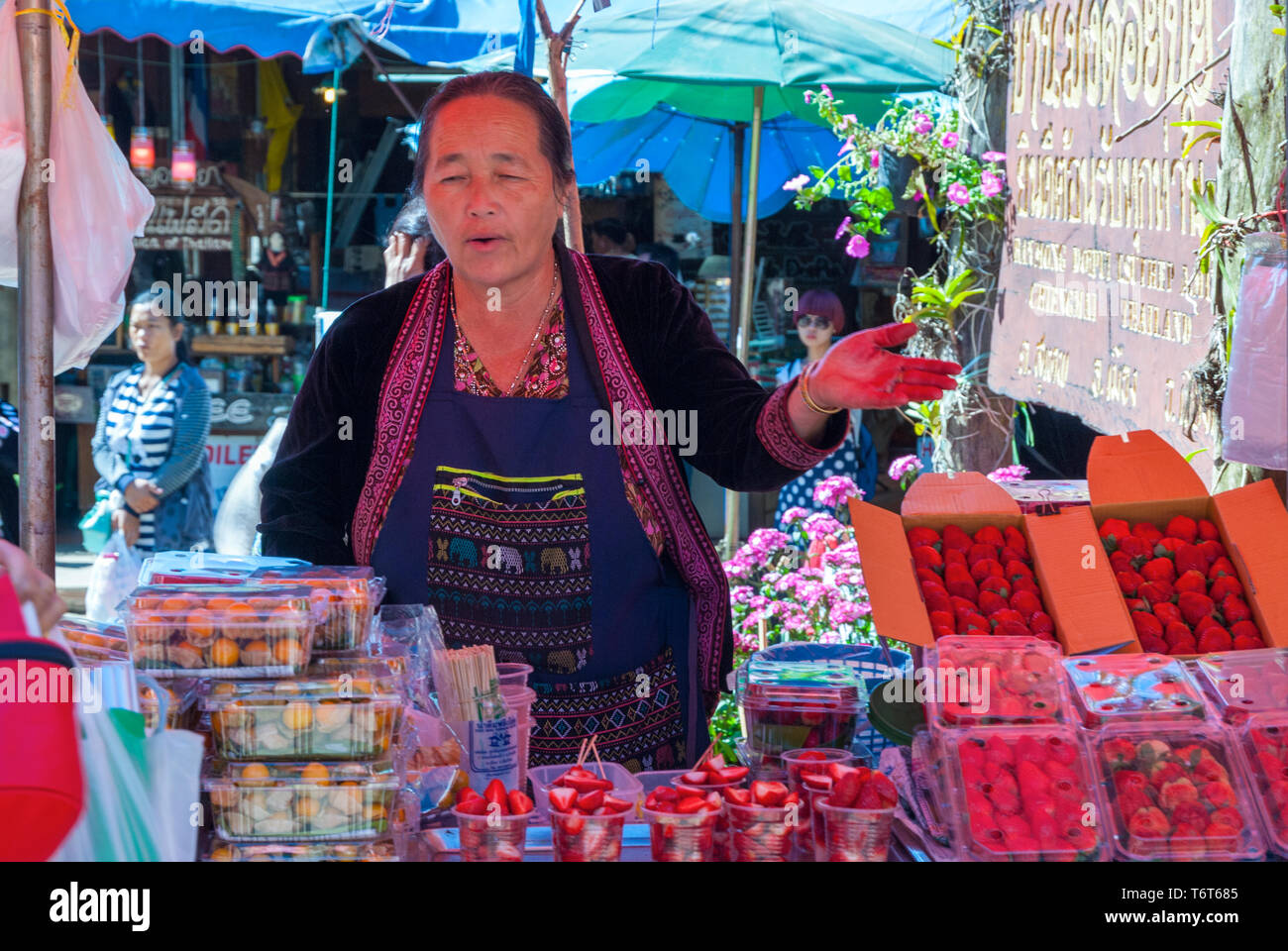 Chiang Mai, Thailand - Dec 2015: Lady selling strawberries at local ...
