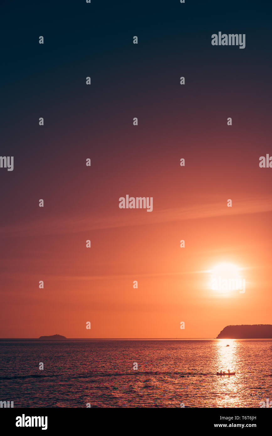 Sunset over rocky coastline hi-res stock photography and images - Alamy